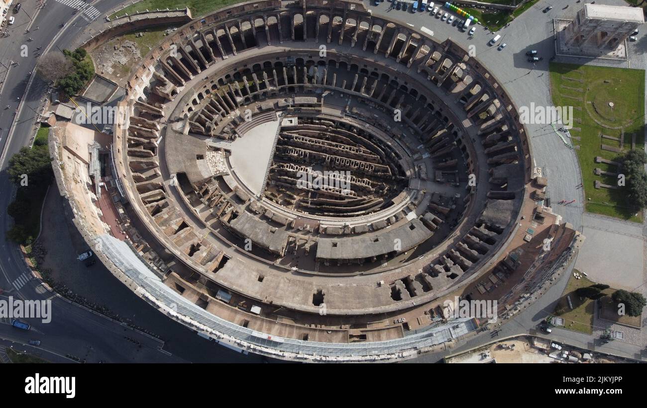 An aerial view of the famous Colosseum on a beautiful sunny day in Rome ...