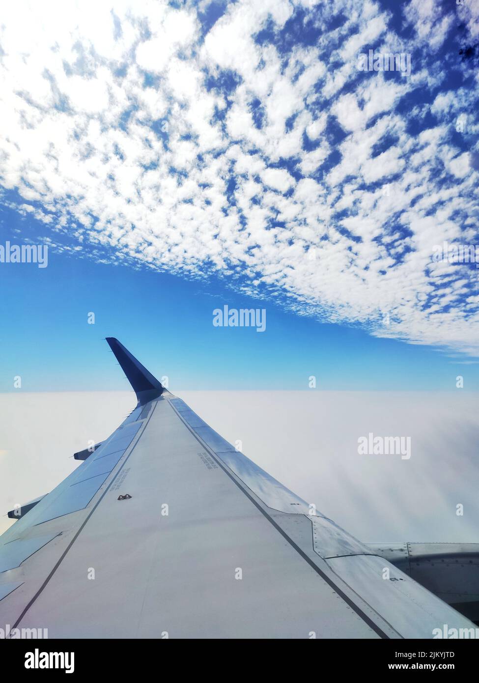 The cloud view and airplane wing from the window plane Stock Photo - Alamy