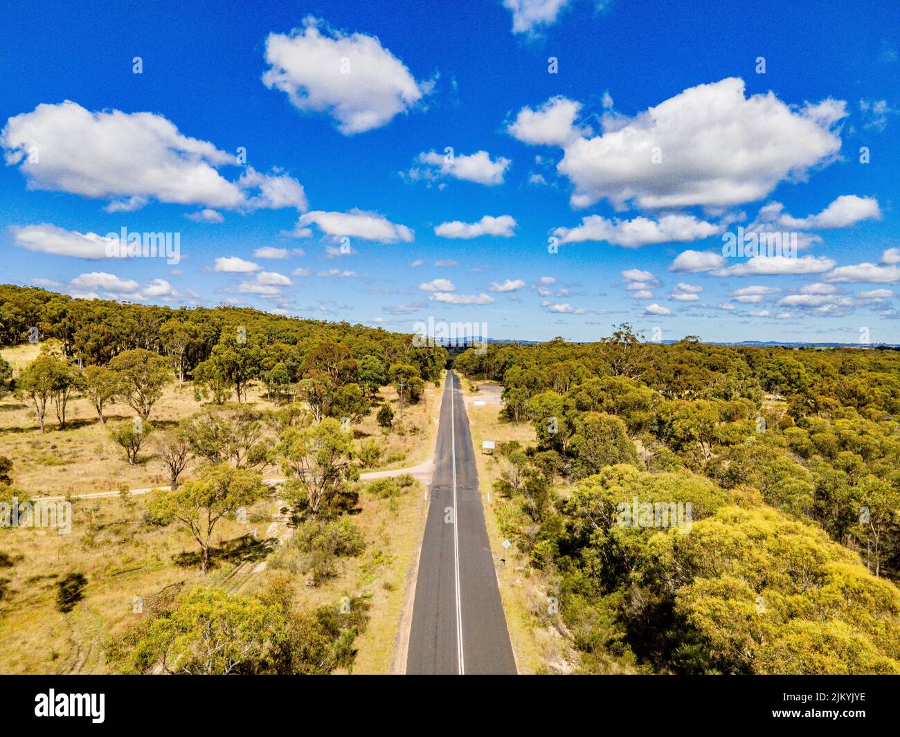 An aerial picturesque view of the Glen Innes Road cutting through the ...