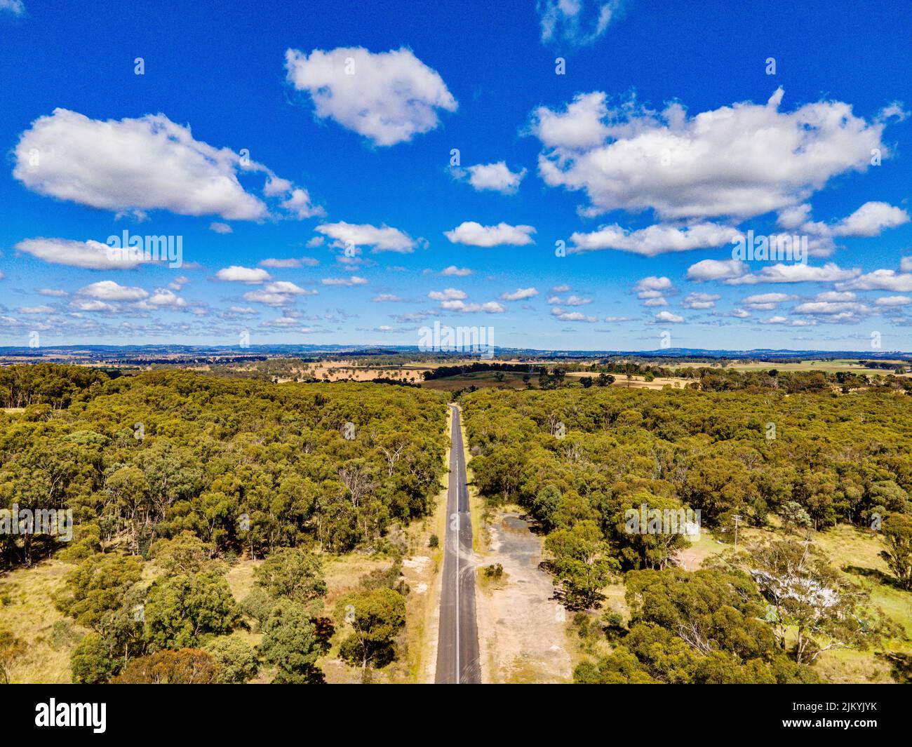 An aerial picturesque view of the Glen Innes Road cutting through the ...