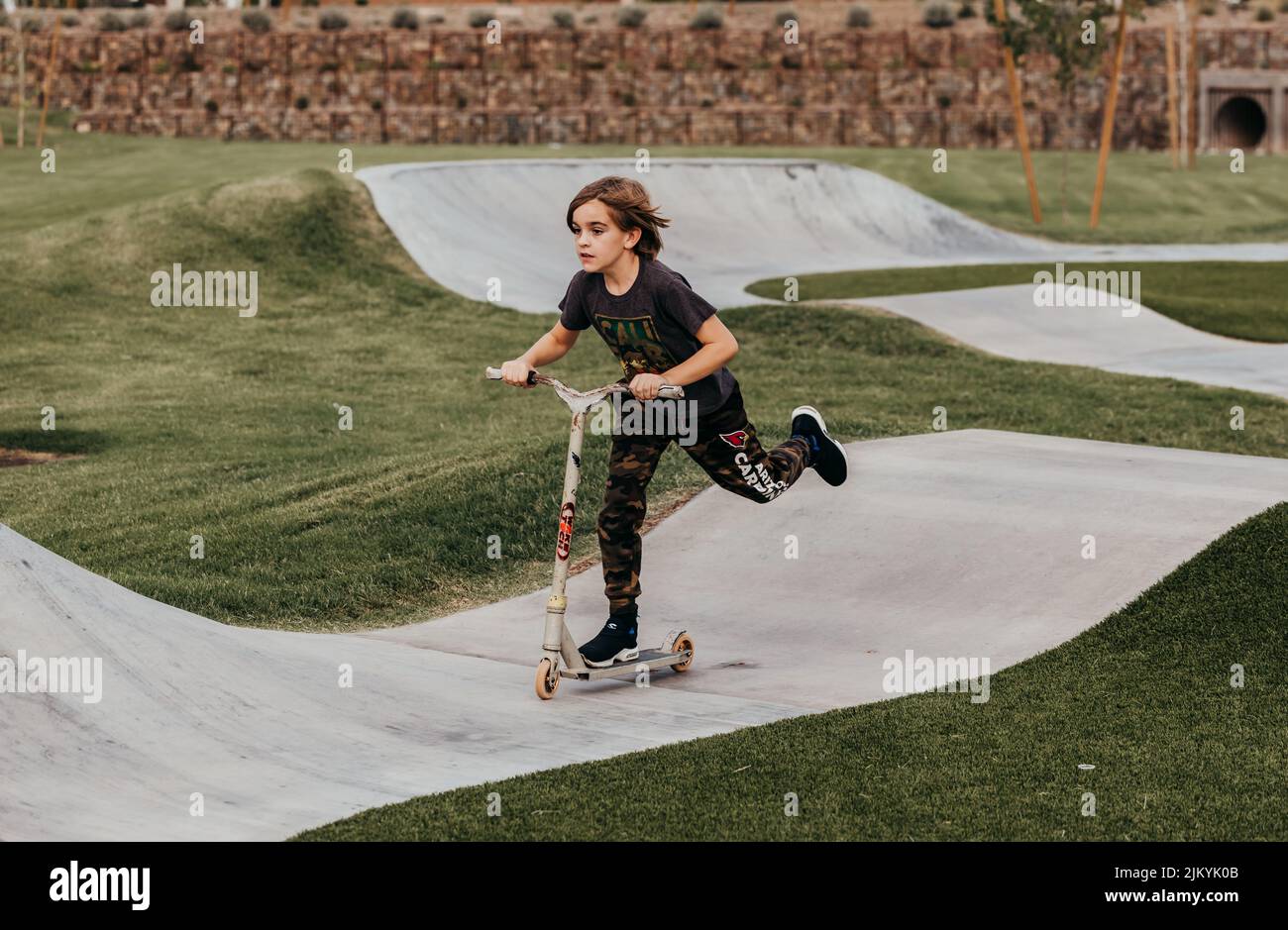 Boys Riding at a Skatepark at sunset and night. Riding Skateboards ...