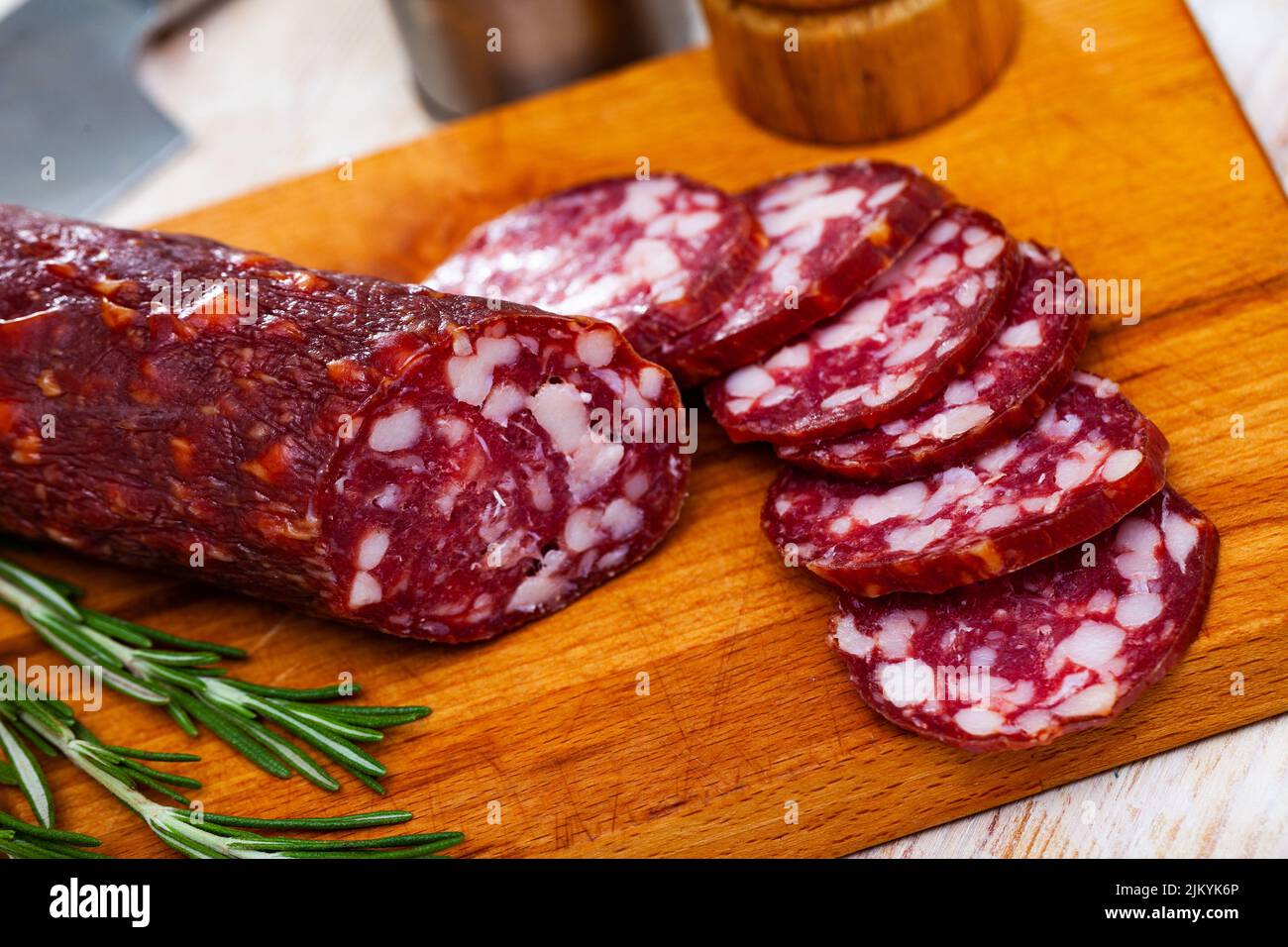 Tasty dried semi-dry sausage Braunschweig with rosemary Stock Photo - Alamy