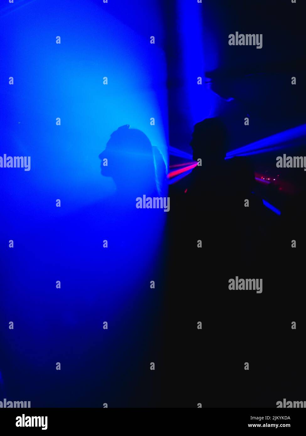 Partying people in neon lights Stock Photo - Alamy