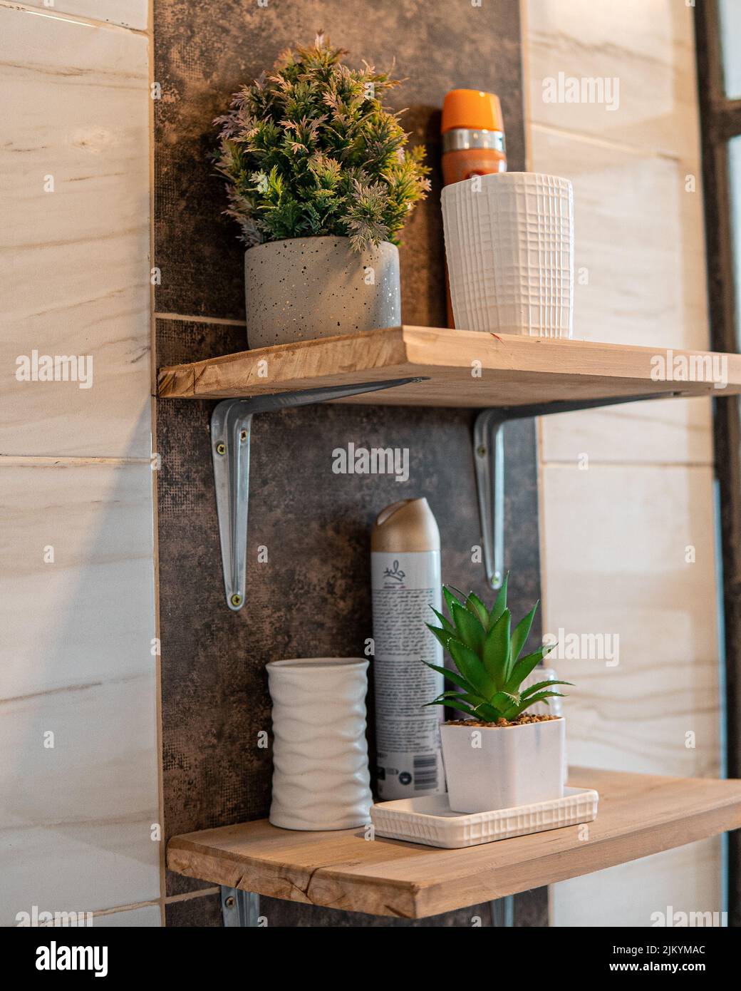 A selective of shelves on a wall with plants Stock Photo - Alamy