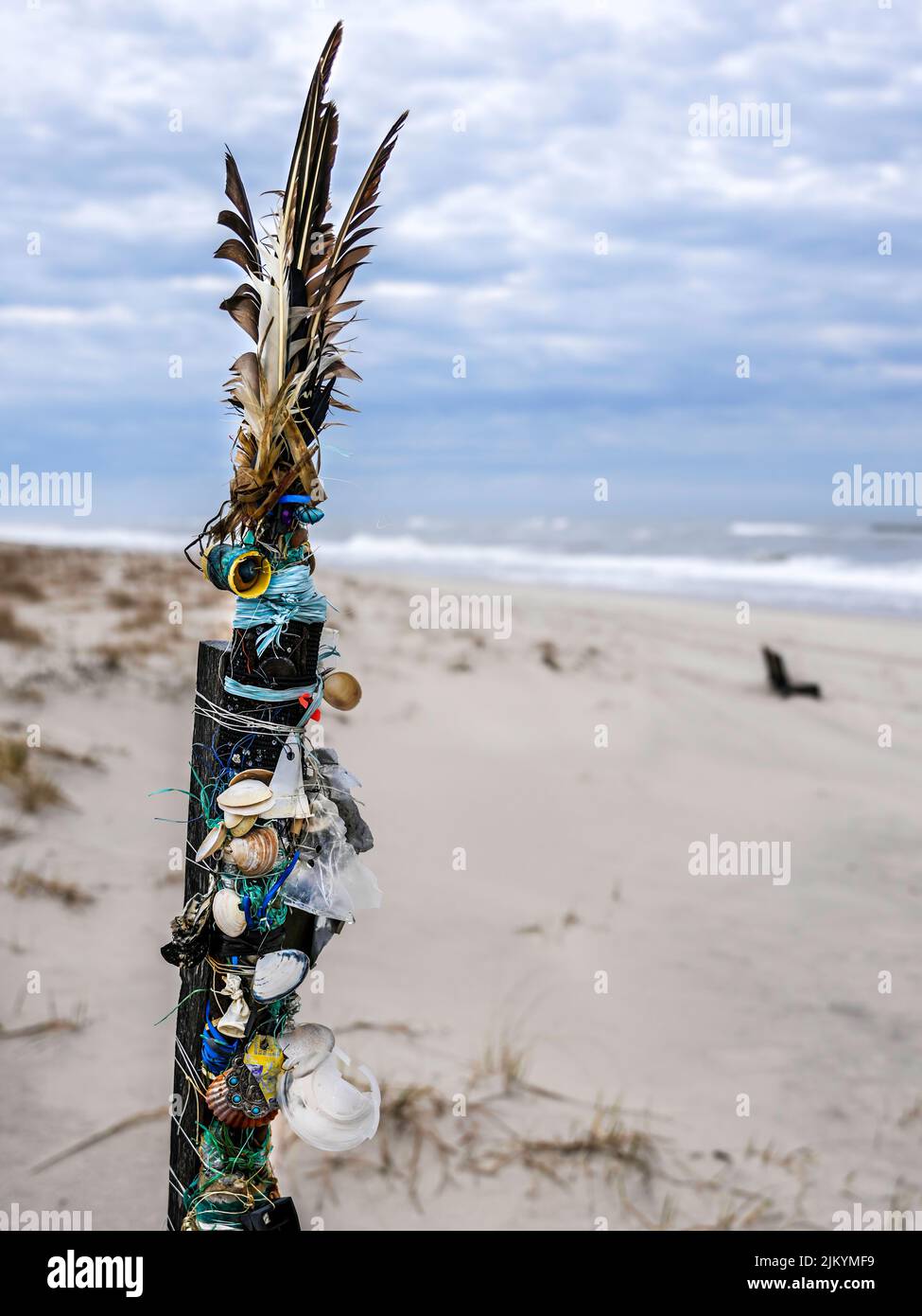 A selective of a decorated pole at a sandy beach Stock Photo - Alamy
