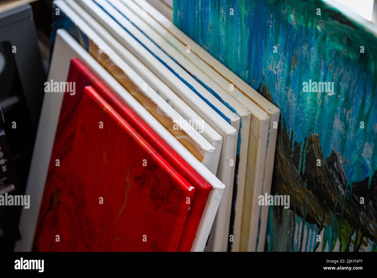 Frames and works stacked in an oil painting studio Stock Photo - Alamy