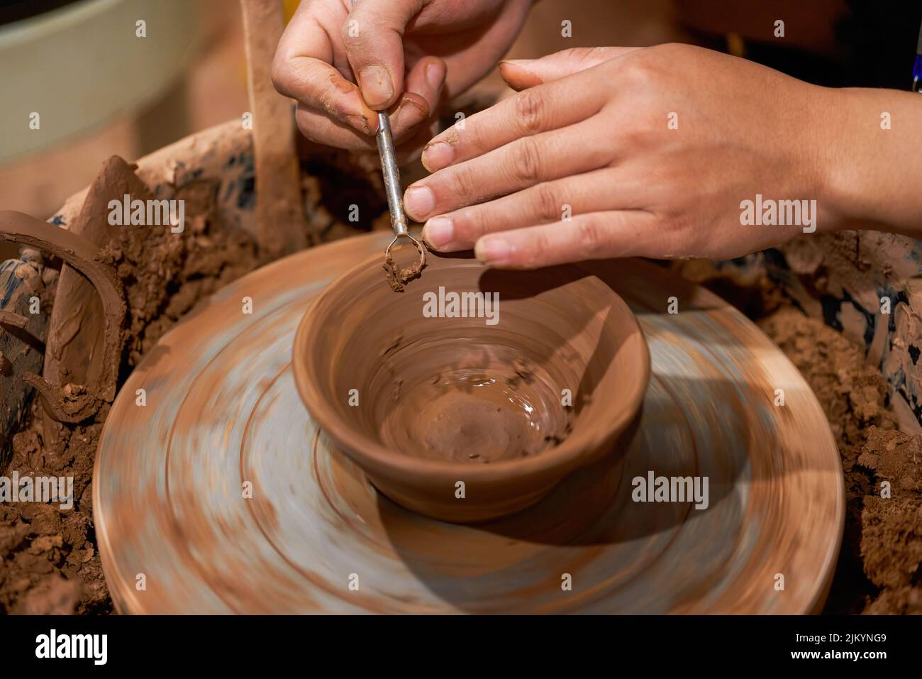 Craftsmen in pottery shop making clay pottery Stock Photo - Alamy