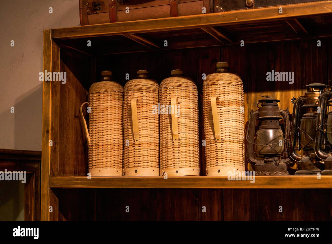 Vintage bamboo braided kettle and kerosene lamp Stock Photo - Alamy