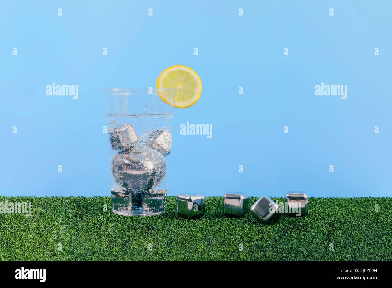 creative summer photo of ice and water cup, blue background Stock Photo ...