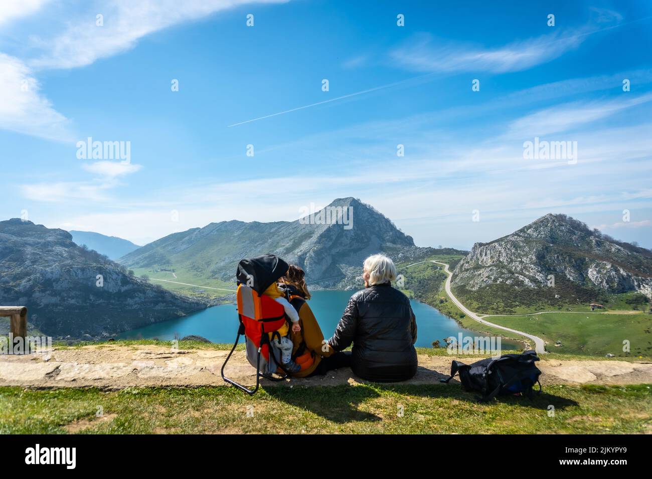 Grandmother, mother and son looking at Lake Enol in the Lakes of ...