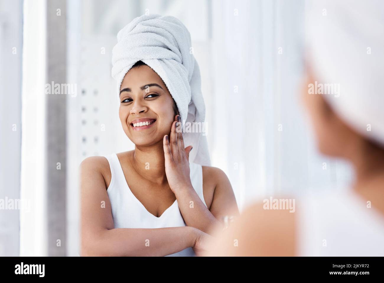 Cant get enough of myself today. a young woman going through her beauty ...