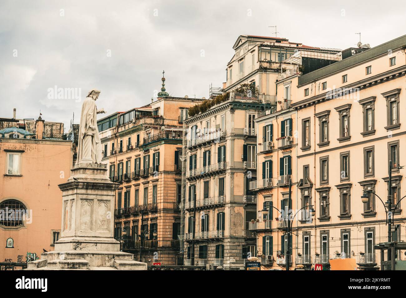 A historical buildings and a statue in Piazza Dante public square of ...