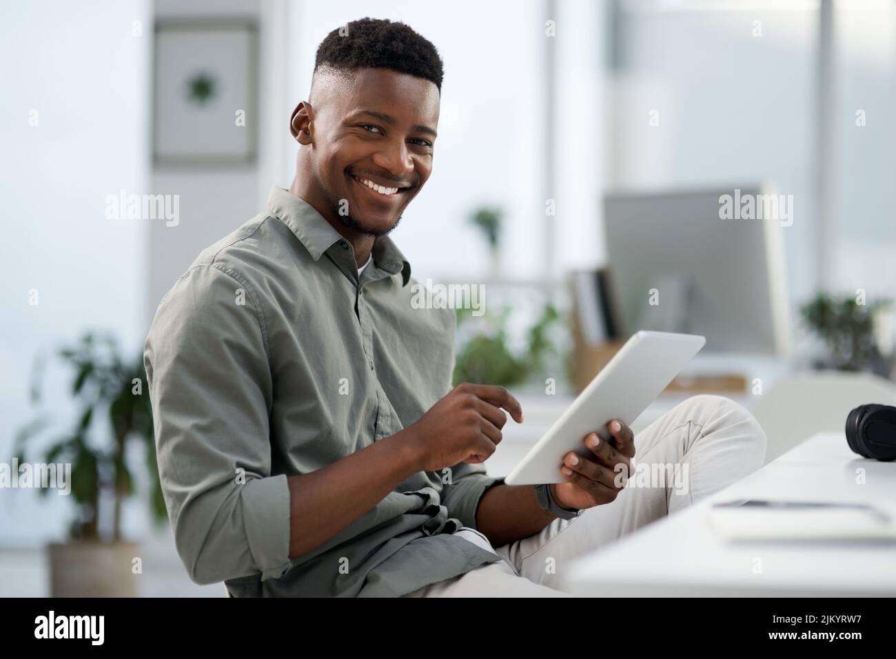 The stats are looking good. a young businessman working on a computer ...