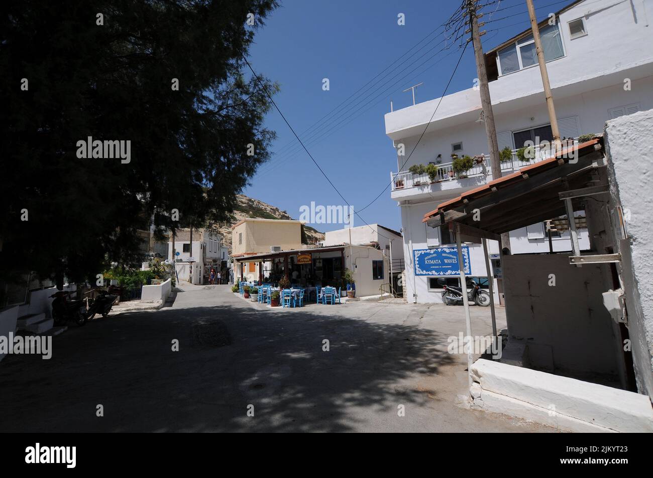 Street in Matala town of Greece Stock Photo - Alamy