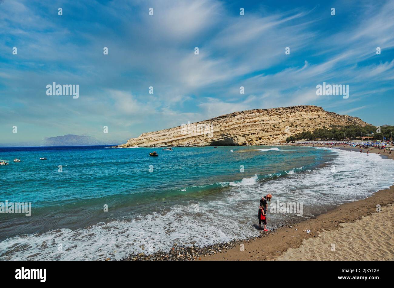 Matala, beautiful beach on Crete island, waves and rocks. Panorama ...