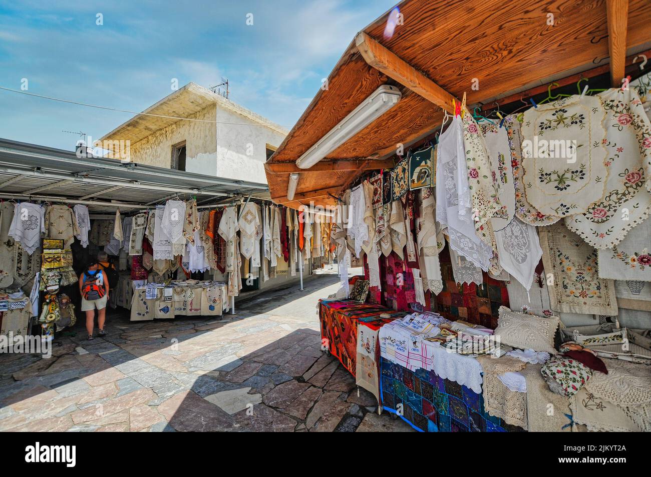 Tourist in a shop of Matala town on Crete island Stock Photo - Alamy