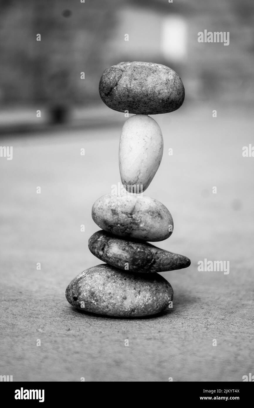 A vertical grayscale shot of impossibly stacked rocks Stock Photo - Alamy