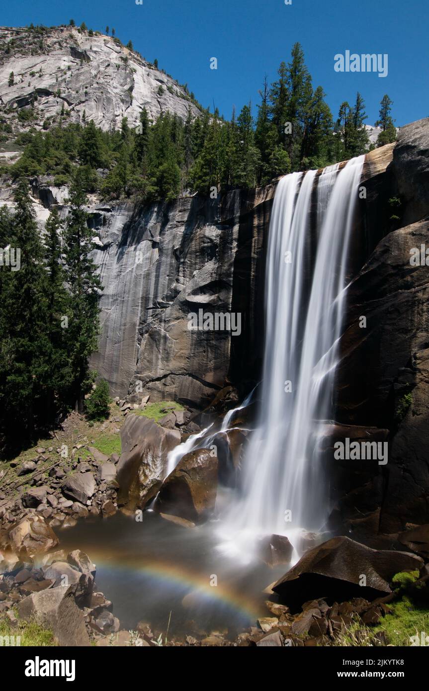 The scenic waterfalls with reflection of rainbow on water in the ...