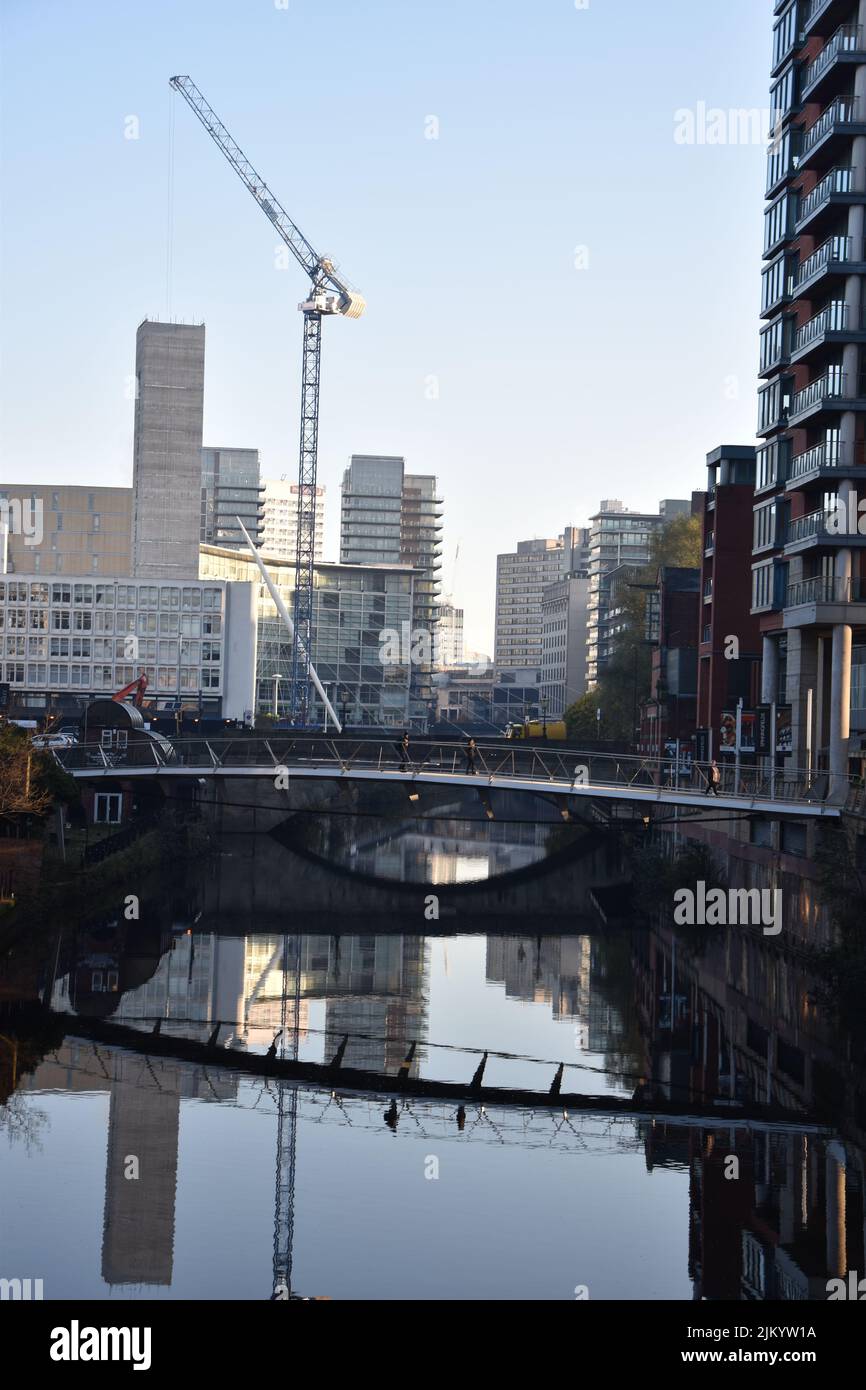 A scenery of urban buildings and new constructions with cranes in ...