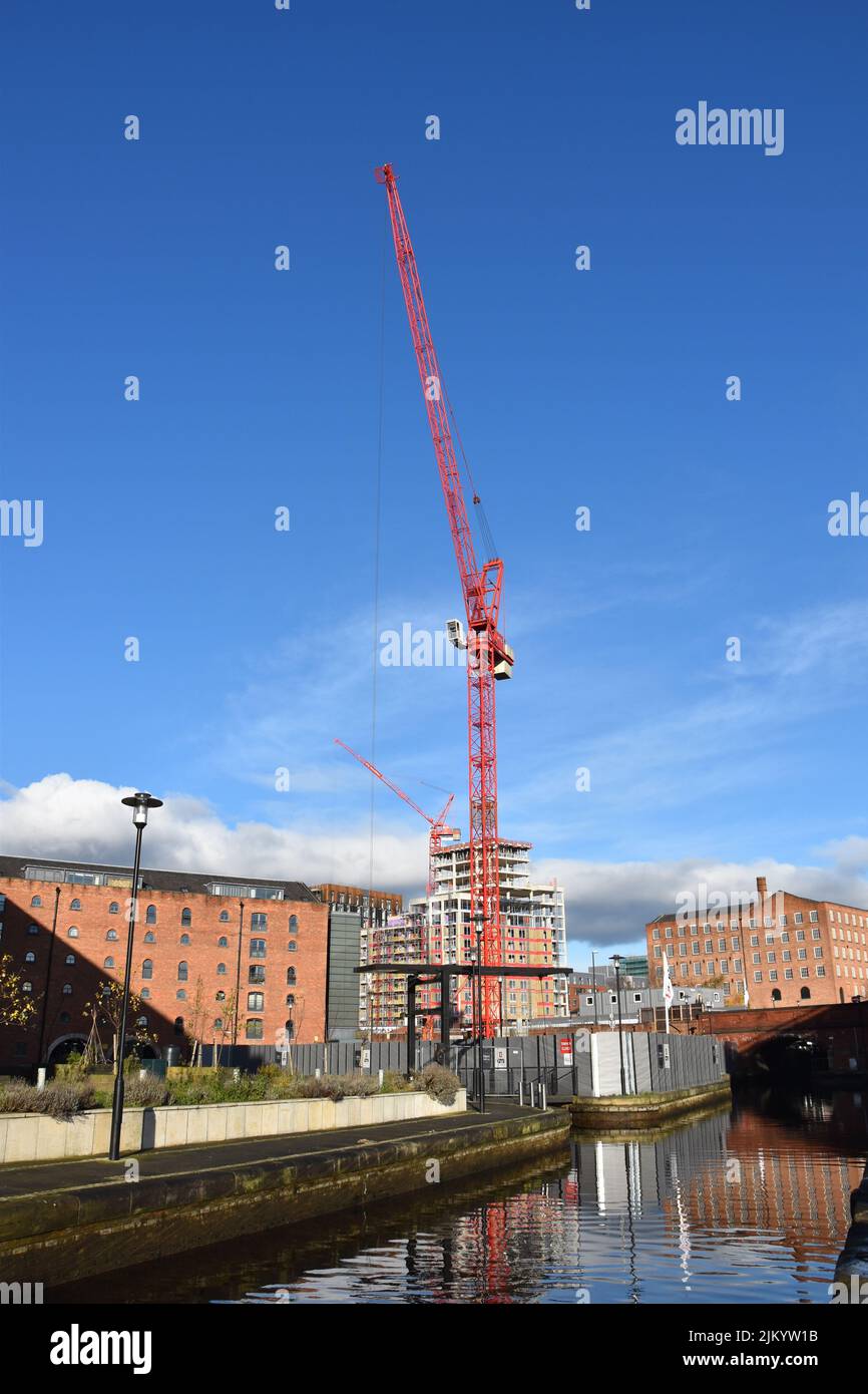 A scenery of urban buildings and new constructions with cranes in ...