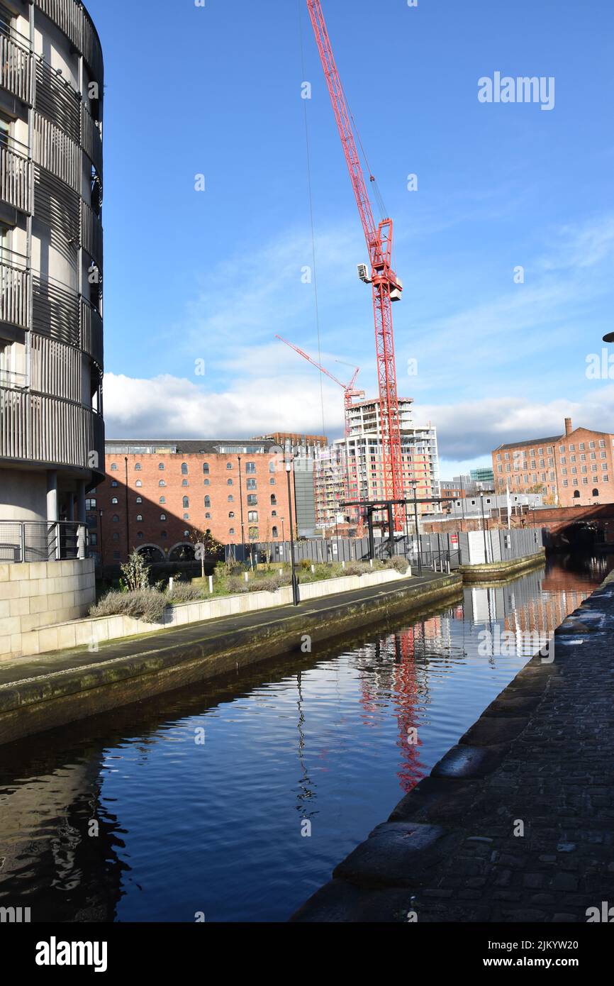 A scenery of urban buildings and new constructions with cranes in ...