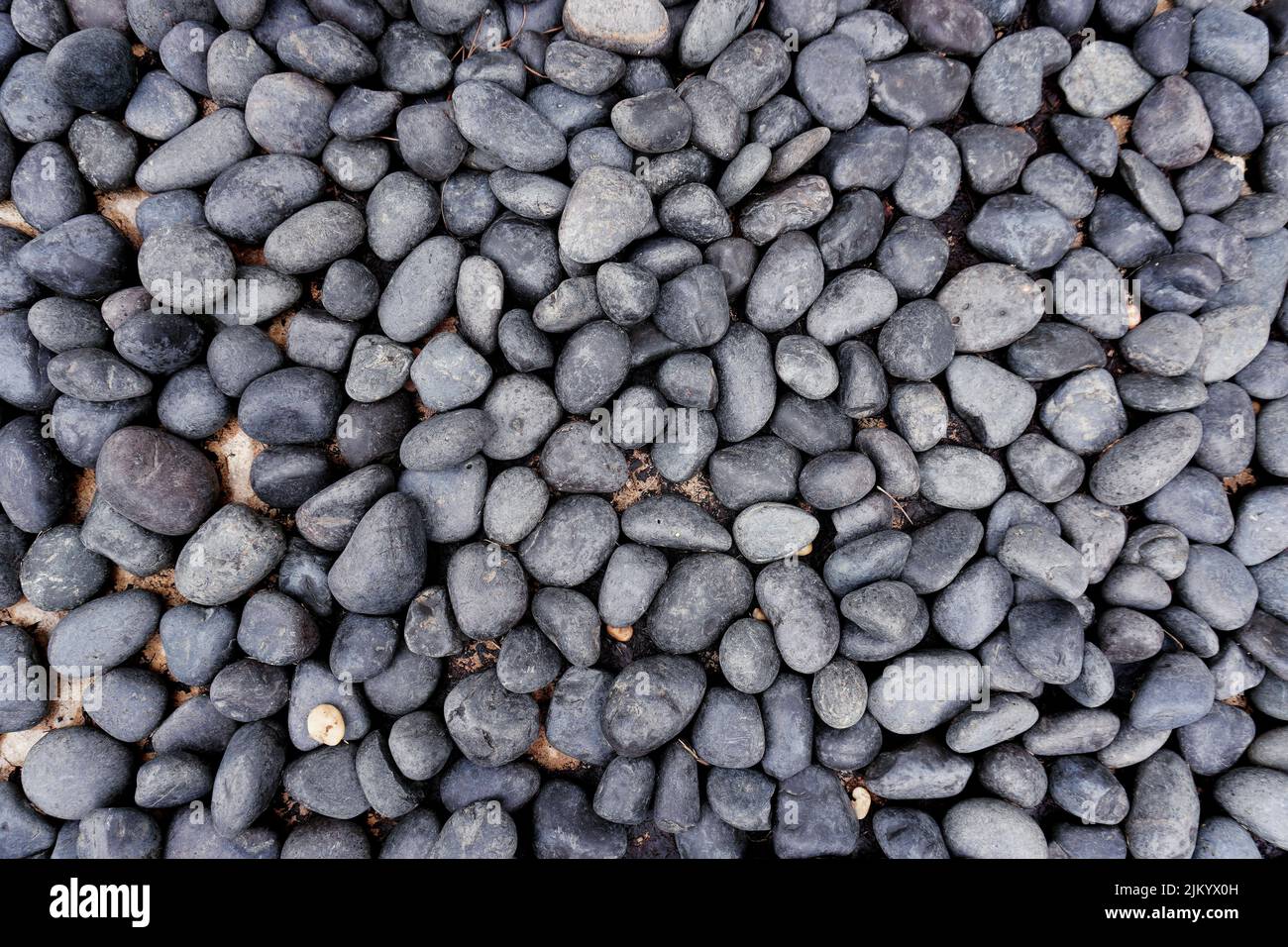 Close up of rounded grey river rocks Stock Photo - Alamy