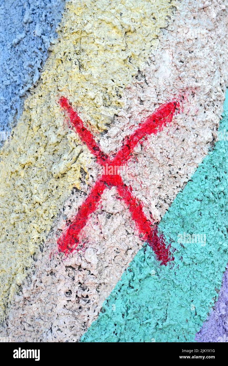 red sign on stone wall closeup, construction technology diversity Stock ...