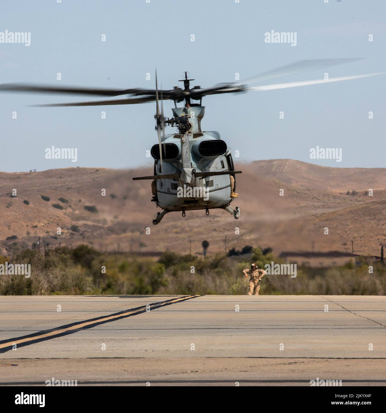 A U.S. Marine with Marine Light Helicopter Attack Squadron (HMLA) 775 ...