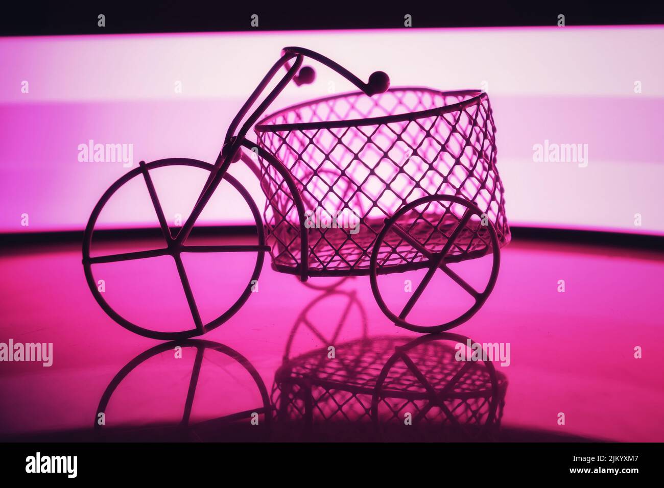 Beautiful cycle with pink background Stock Photo - Alamy