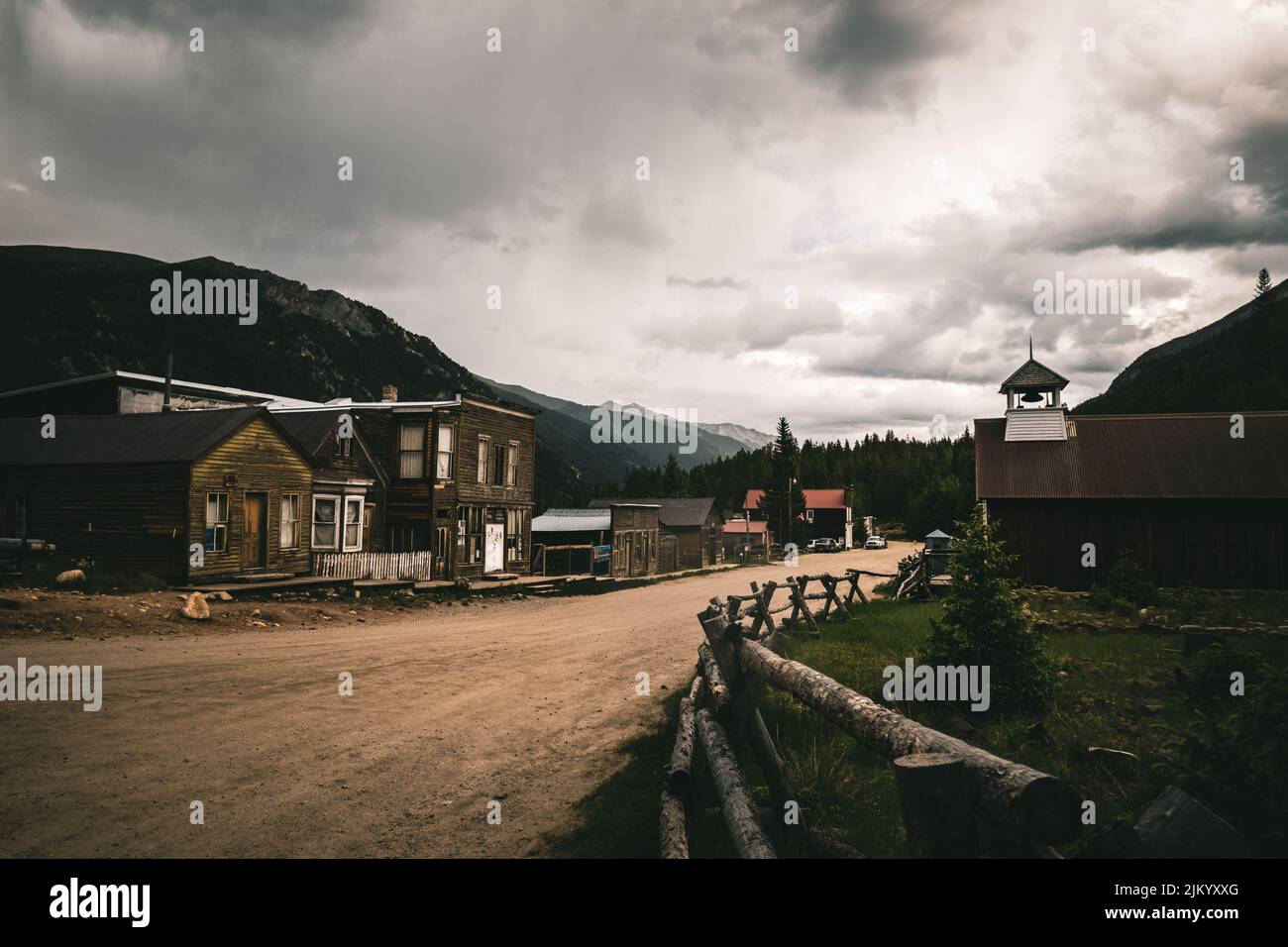 A scenic view of residential buildings in a rural area in cloudy sky ...