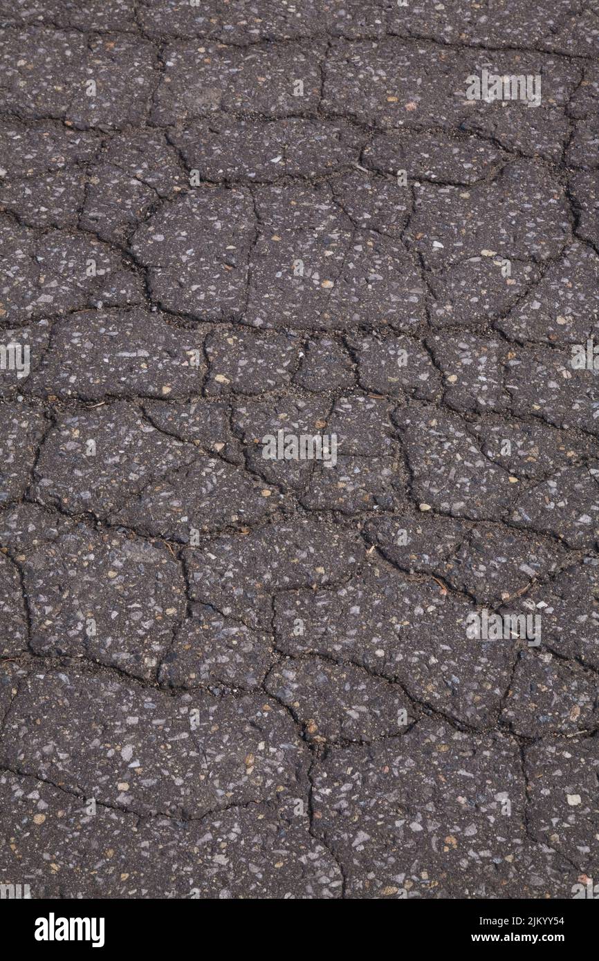 Close-up of cracked asphalt pavement Stock Photo - Alamy