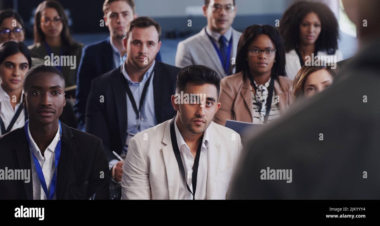 Serious diverse group listening hi-res stock photography and images - Alamy