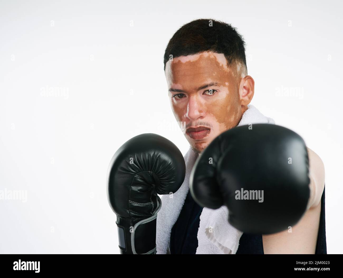 Impossible is nothing. Portrait shot of a handsome young male boxer ...