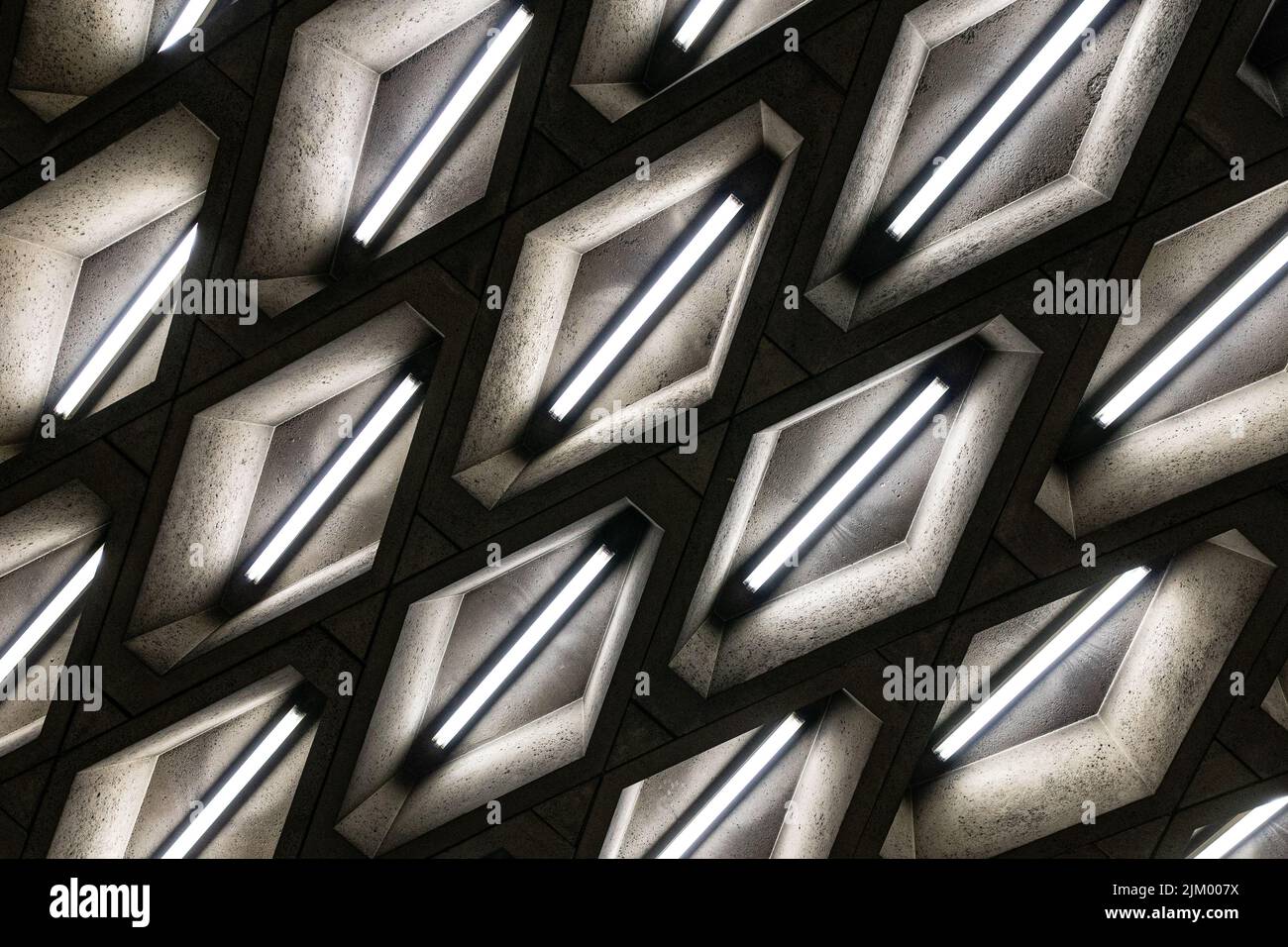 An abstract architectural building background with led strip lights ...