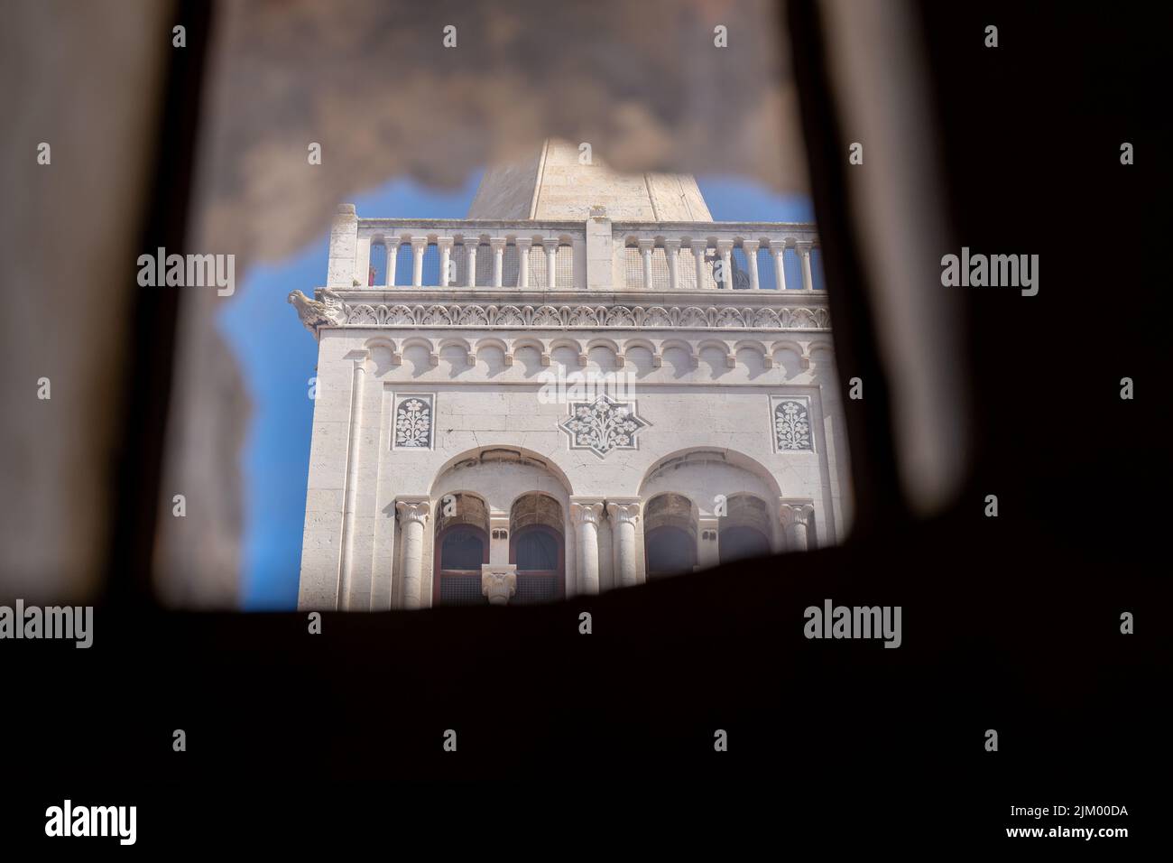 A church tower seen through a window of an old building Stock Photo - Alamy