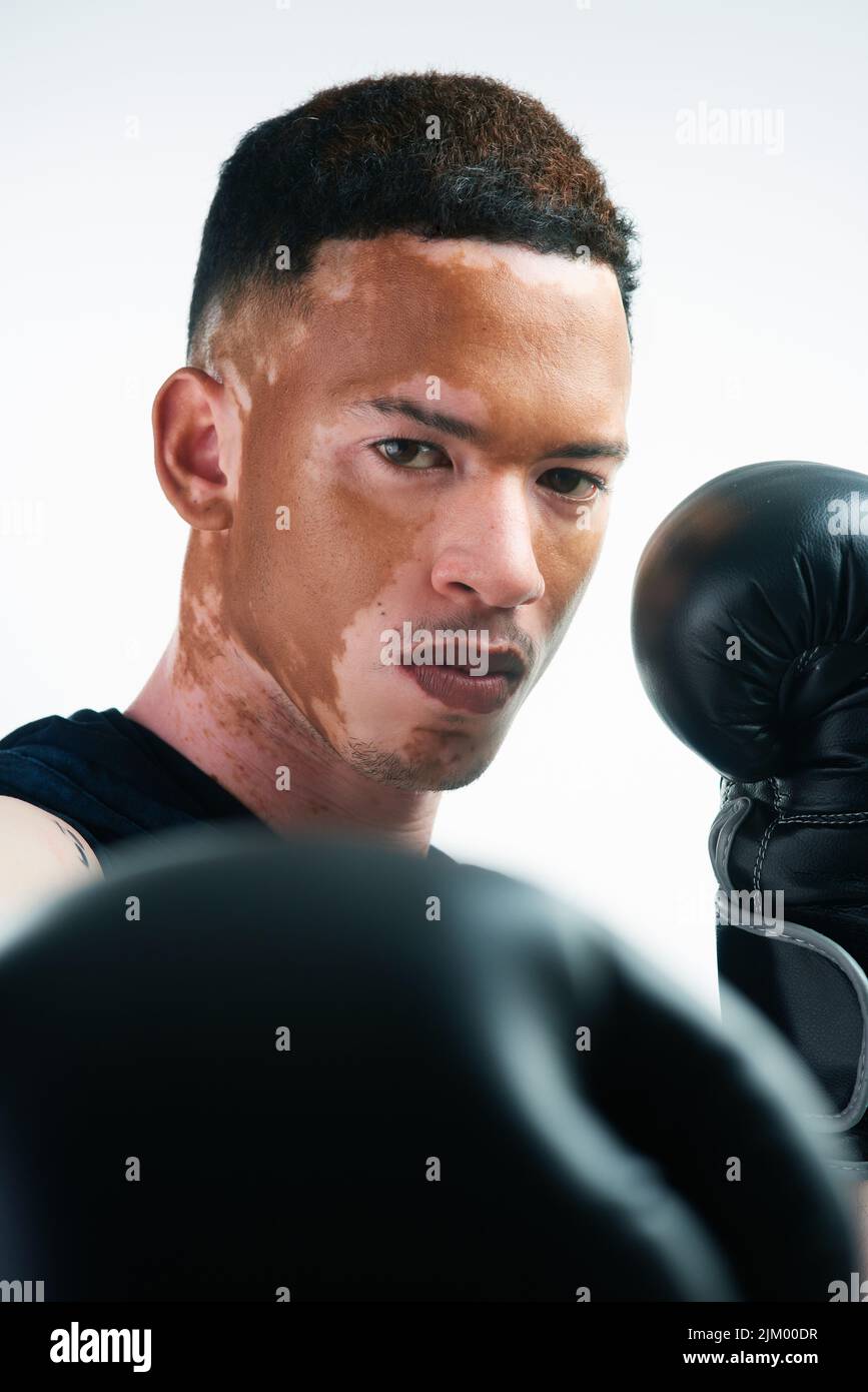 When life gets tough put on your boxing gloves. Cropped portrait shot ...