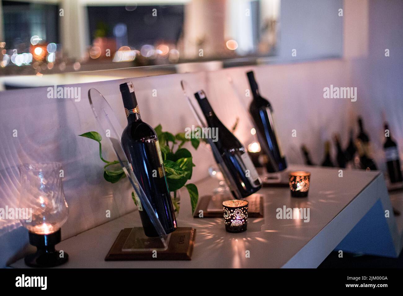 Different wine bottles in a luxurious restaurant Stock Photo - Alamy
