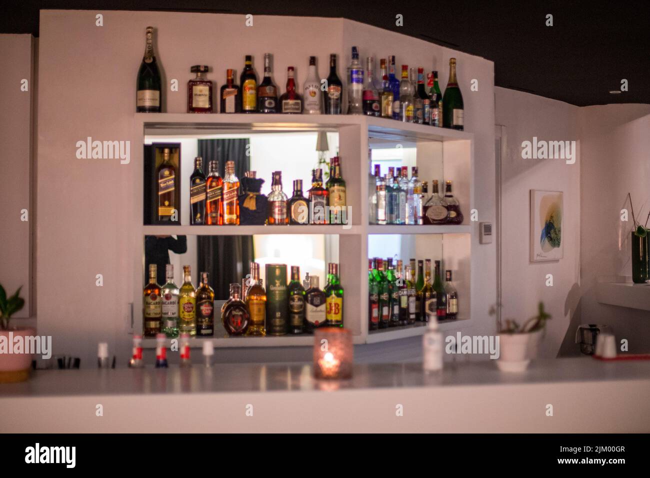 Different alcohol bottle on the shelf of a restaurant bar Stock Photo ...