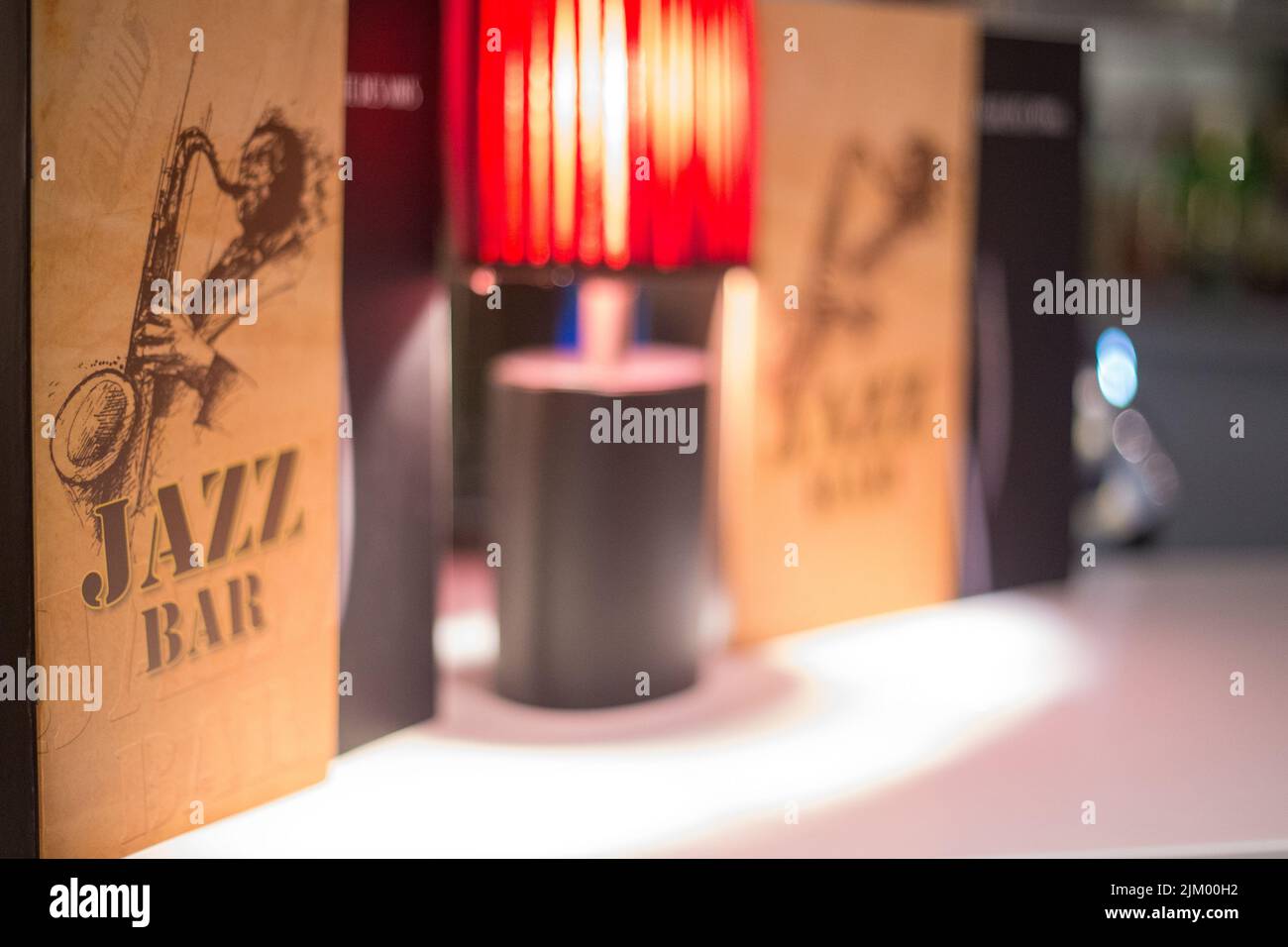 Red side lamp glowing in the middle of two banners of Jazz bar Stock ...