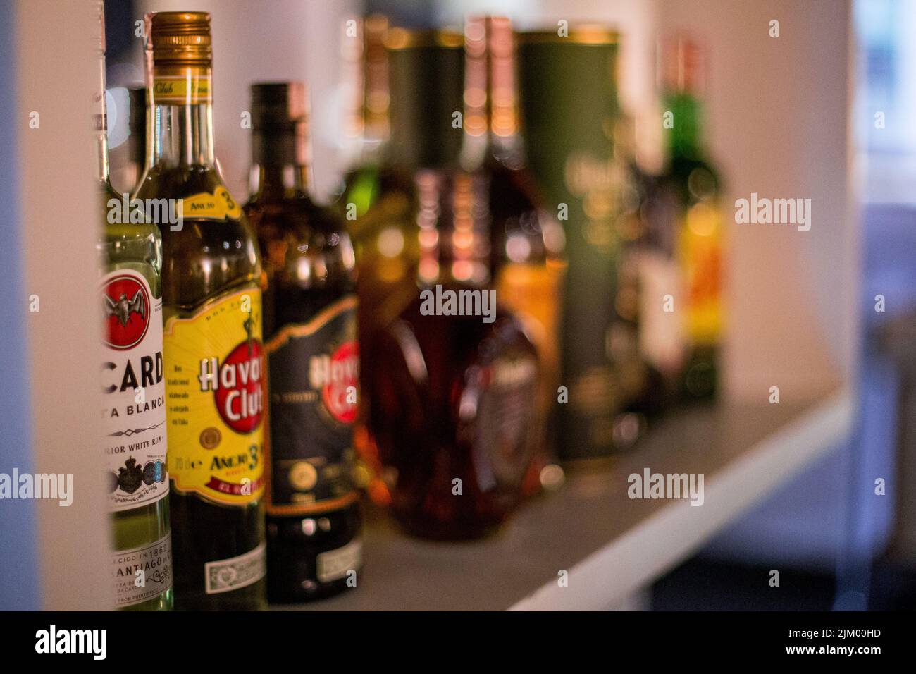 Different alcohol bottle on the shelf of a restaurant bar Stock Photo ...