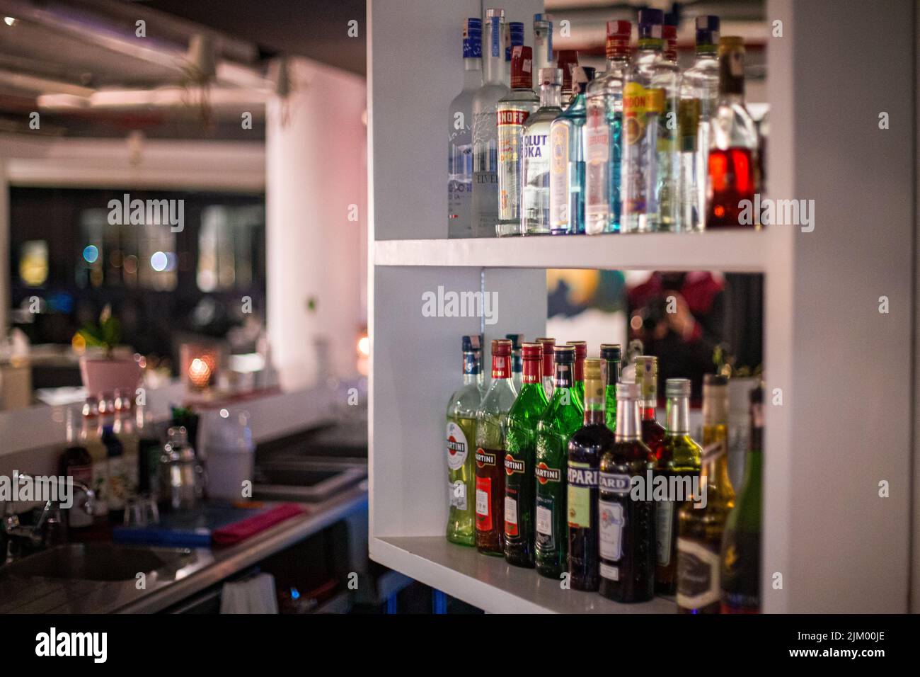 Different alcohol bottle on the shelf of a restaurant bar Stock Photo ...