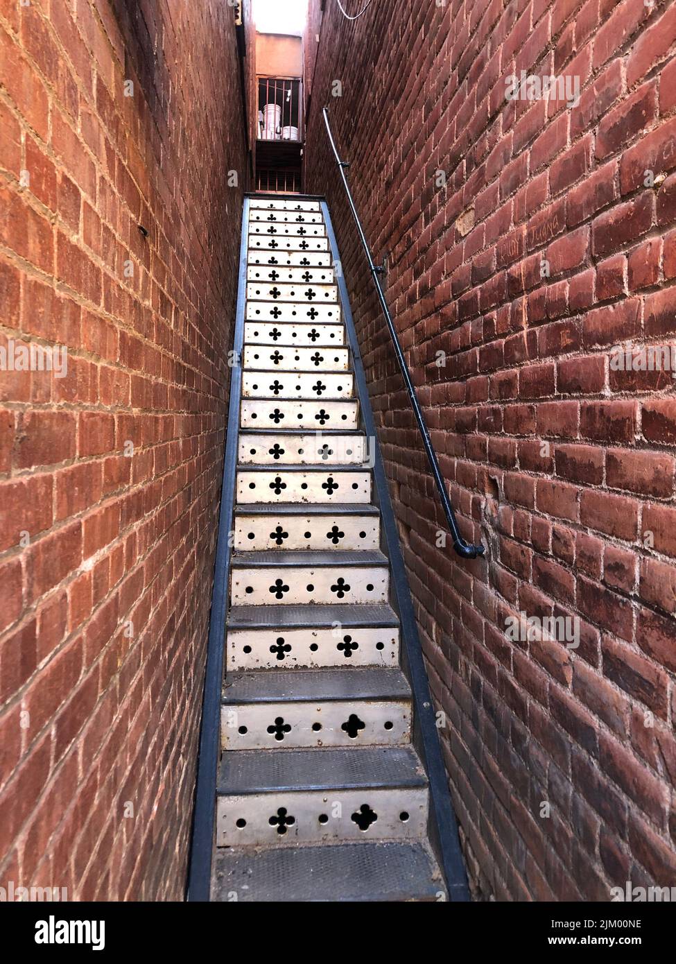 A beautiful interior design of Bisbee AZ metal stairs between red brick ...