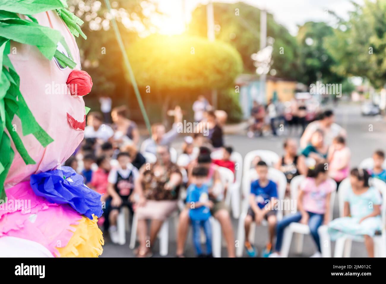Group of Latin people with a pinata to participate in a neighborhood ...
