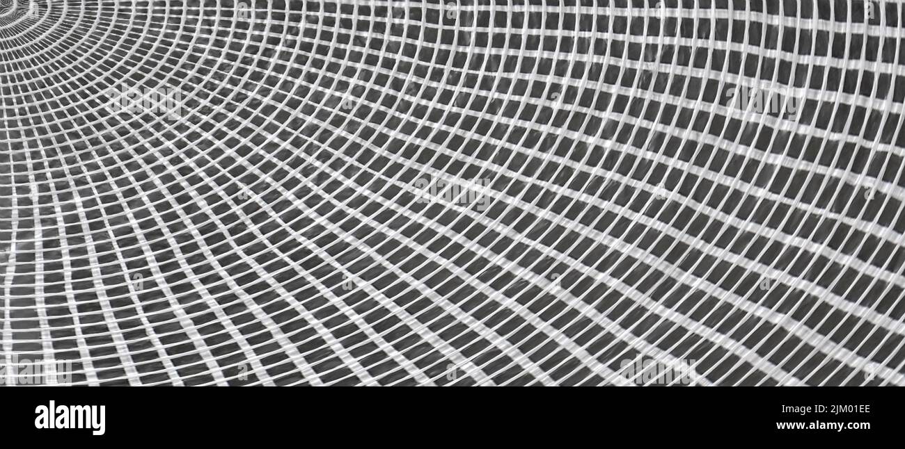 abstract plastic grid surface closeup with small cells, modern ...