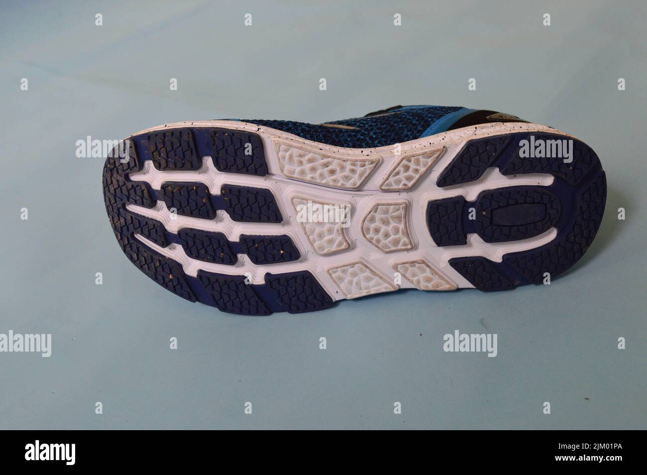 under the soles of running shoes after use Stock Photo - Alamy