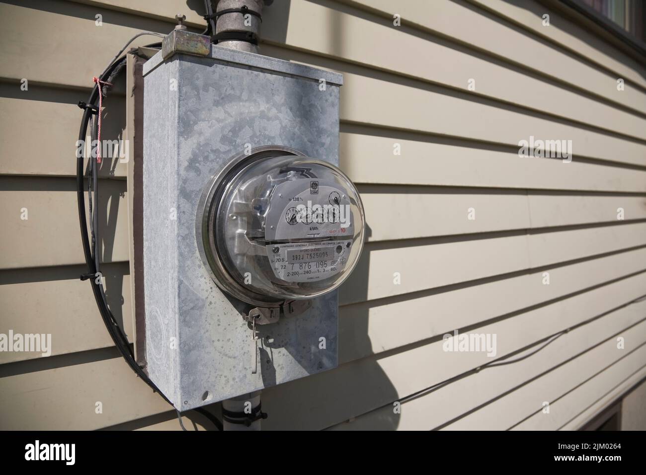 Hydro electricity consumption meter on the exterior wall of a home ...