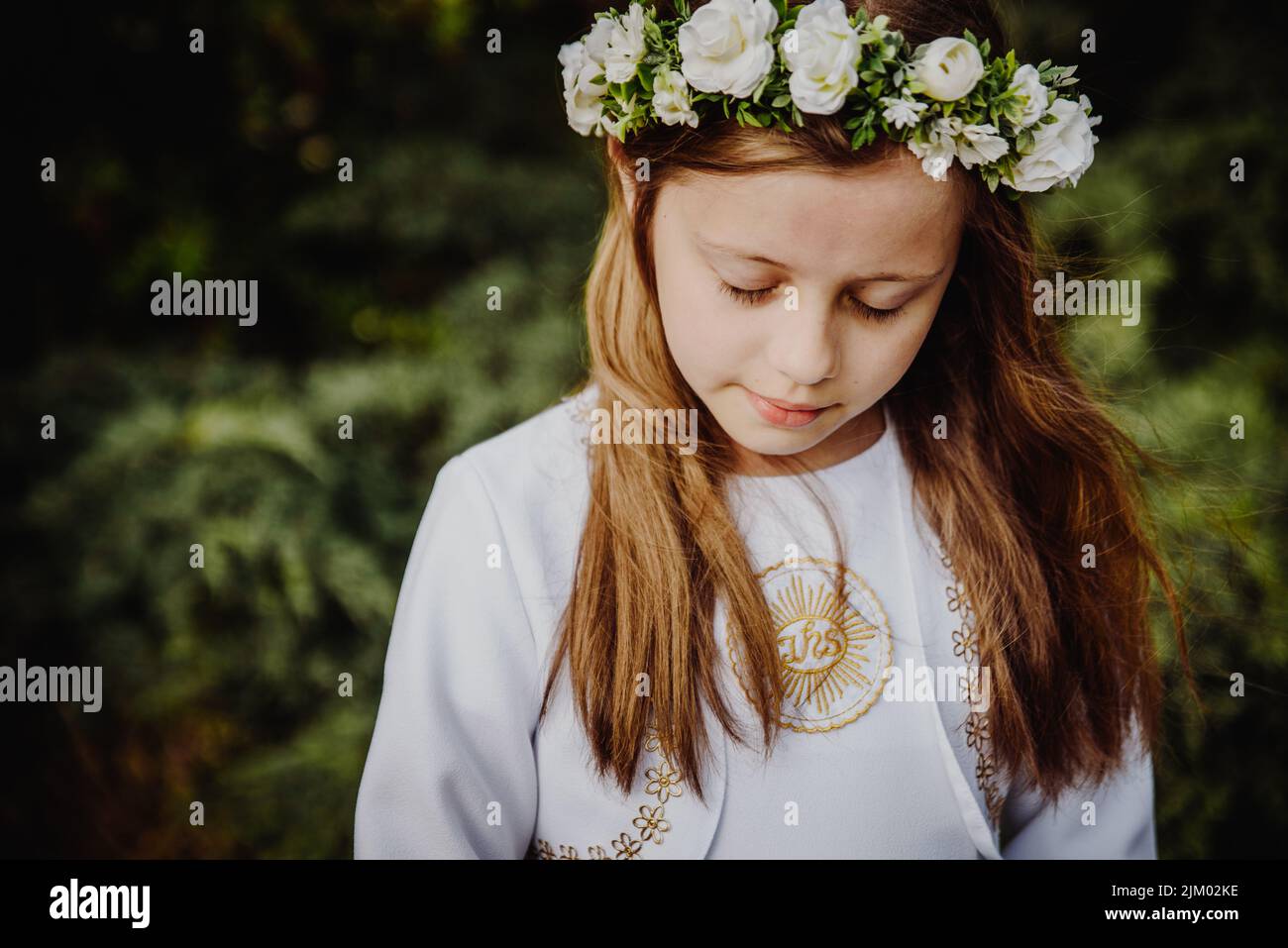 A Beautiful Girl Wearing A White Flower Crown On A Blurred Background