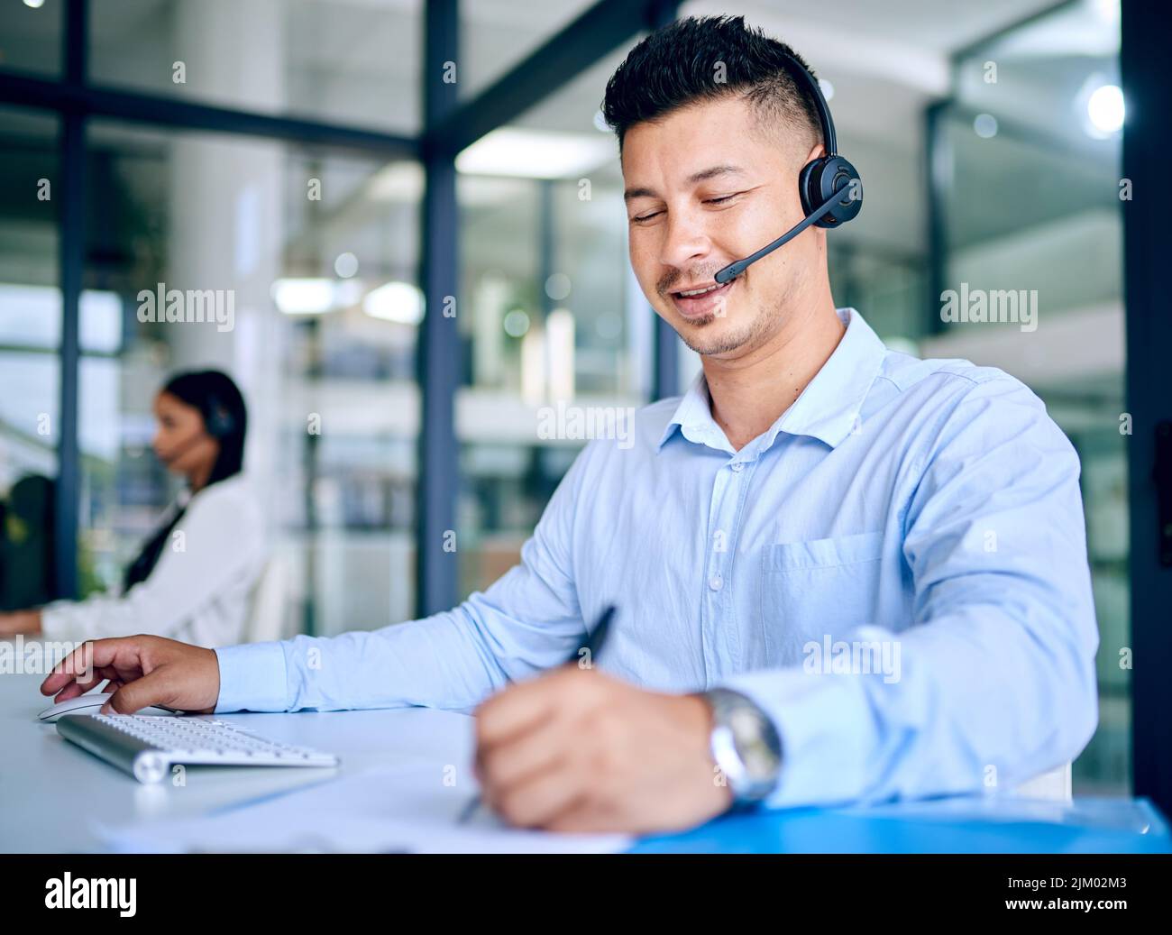 Expand your client base, change your business. a young man writing ...