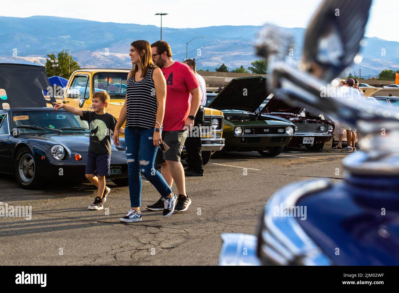 A family enjoying the classic cars on display. Vehicles and car ...