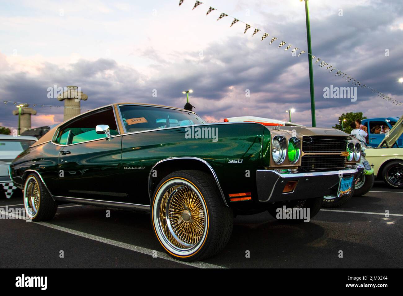 A classic Chevy Malibu is on display. Vehicles and car enthusiasts ...
